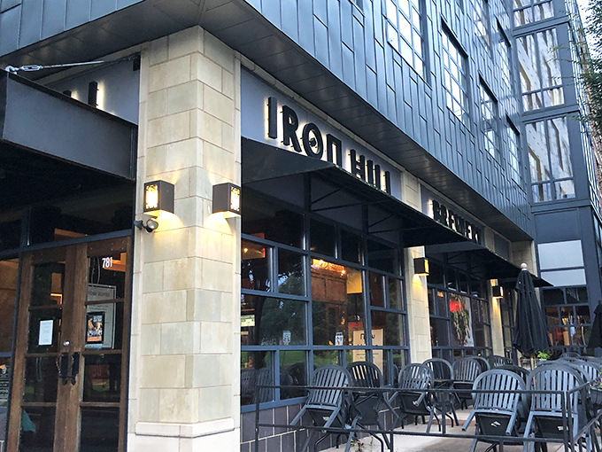 The corner storefront glows with promise as evening falls, beckoning beer lovers like a lighthouse for the happily thirsty.
