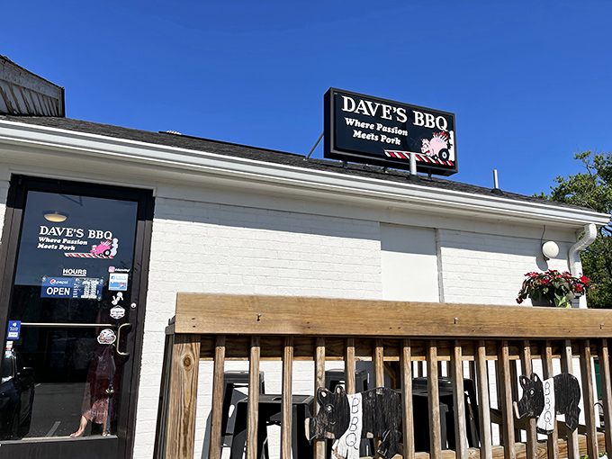 The humble white brick exterior of Dave's BBQ with its "Where Passion Meets Pork" sign serves as the gateway to Virginia's smoky paradise.
