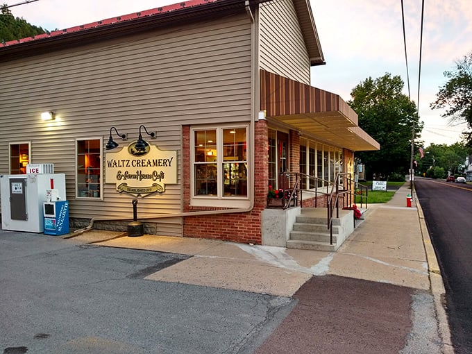 The twilight glow transforms this unassuming rural creamery into a beacon of culinary promise. Warm light spills from windows, inviting weary travelers to step inside and discover Pennsylvania's best-kept secret.