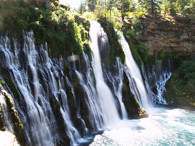 Nature's masterpiece in full display &ndash; Burney Falls cascades 129 feet in a hypnotic ballet of water and light that makes Niagara text you, "We need to talk."