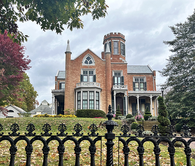 The Castle rises from Marietta like a Victorian dream, its brick turret and Gothic details whispering tales of a more elegant era.