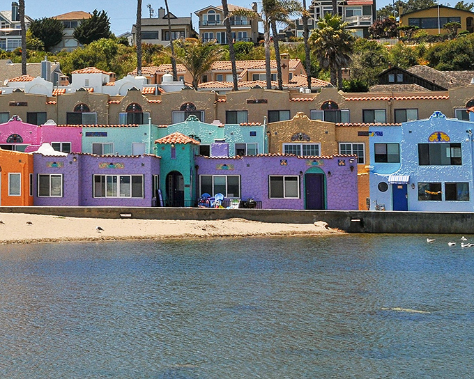 Candy-colored cottages line Capitola Beach like a Mediterranean daydream that somehow landed in California. Pure postcard perfection!