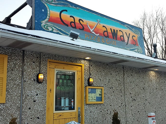 The weathered sign tells you everything: this isn't fancy, but that sunset color palette promises something special awaits inside. Lake Erie vibes done right.