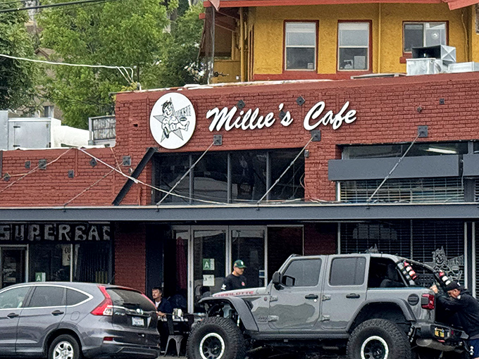 Millie's iconic red-brick facade stands out like a beacon of breakfast hope on a Silver Lake corner, promising culinary salvation to the hungry masses.