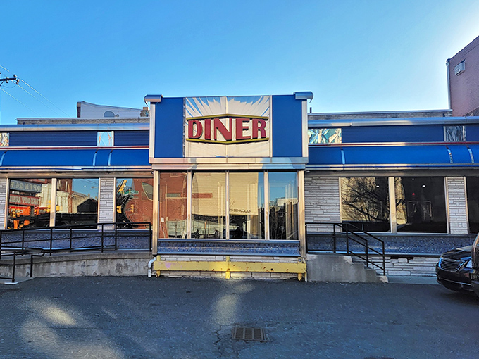 The iconic blue exterior of Broad Street Diner stands as a beacon of breakfast hope on Philadelphia's bustling thoroughfare, promising comfort food and nostalgia in equal measure.