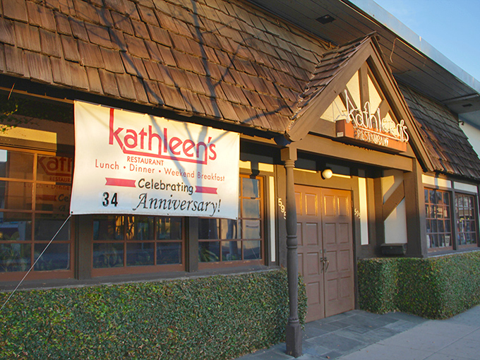The charming cottage-like exterior of Kathleen's Restaurant beckons with its stone foundation and distinctive shingled roof&mdash;a breakfast sanctuary hiding in plain sight.