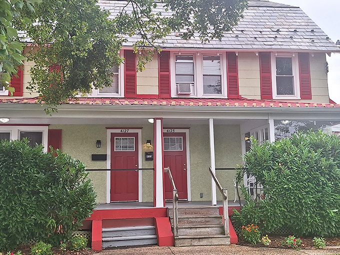 The red and white farmhouse exterior of Cross Keys Diner stands like a beacon of breakfast hope in Doylestown, promising "Good Eats" to all who enter.