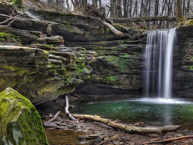 The main attraction delivers on its promise: layered sandstone cliffs where water gracefully cascades into a crystal-clear pool. Mother Nature showing off again.