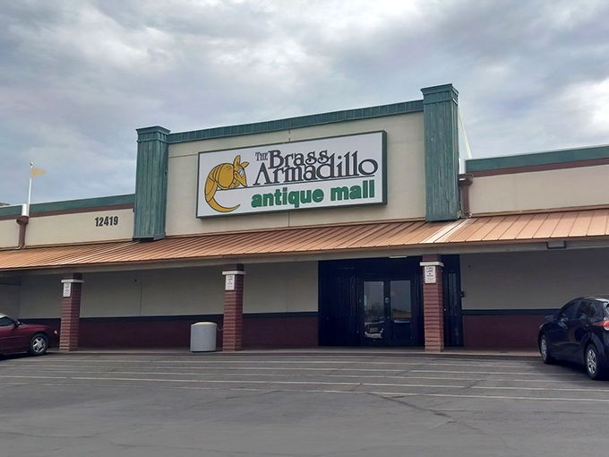 The unassuming exterior hides a universe of treasures within. Like a time-travel portal disguised as a strip mall storefront, the Brass Armadillo beckons.