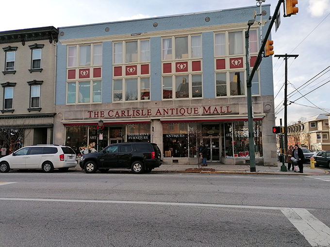 The iconic blue facade of The Carlisle Antique Mall stands proudly on Hanover Street, a beacon for treasure hunters in Pennsylvania's Cumberland Valley.
