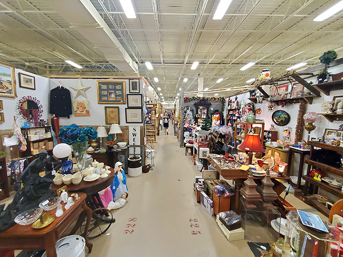 Endless aisles of memories stretch before you at Lakeland Antique Mall, where every booth is a portal to another era.