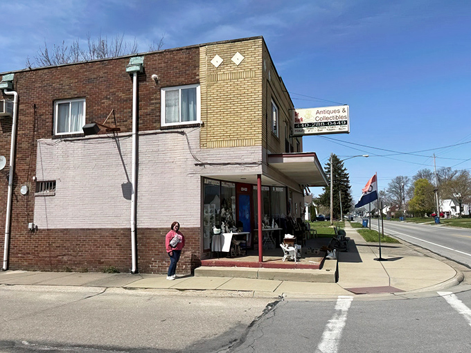 The unassuming storefront beckons with treasures spilling onto the sidewalk. That blue door isn't just an entrance&mdash;it's a time portal to yesteryear.