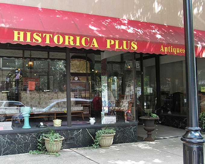 The iconic red awning of Historica Plus beckons treasure hunters like a vintage lighthouse guiding ships to shore. Pennsylvania antiquing at its finest.