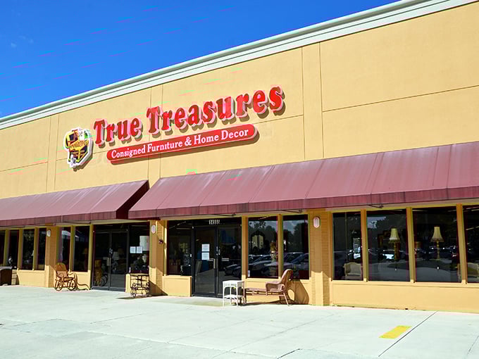 The storefront beckons with its bold red signage and burgundy awnings&mdash;like a treasure chest waiting to be opened in the Florida sunshine.