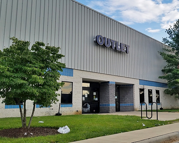 The unassuming exterior of Goodwill Outlet in New Castle hides a universe of undiscovered treasures within its industrial walls.