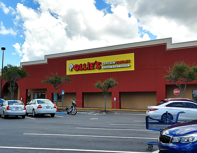 The unmistakable red exterior of Ollie's in Port Charlotte stands like a beacon of bargains against the Florida sky, promising treasures within.