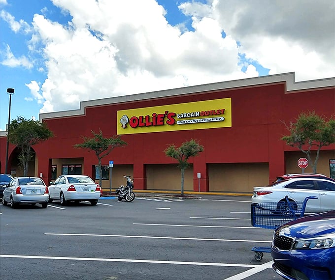 The unmistakable red exterior of Ollie's in Port Charlotte stands like a beacon of bargains against the Florida sky, promising treasures within.