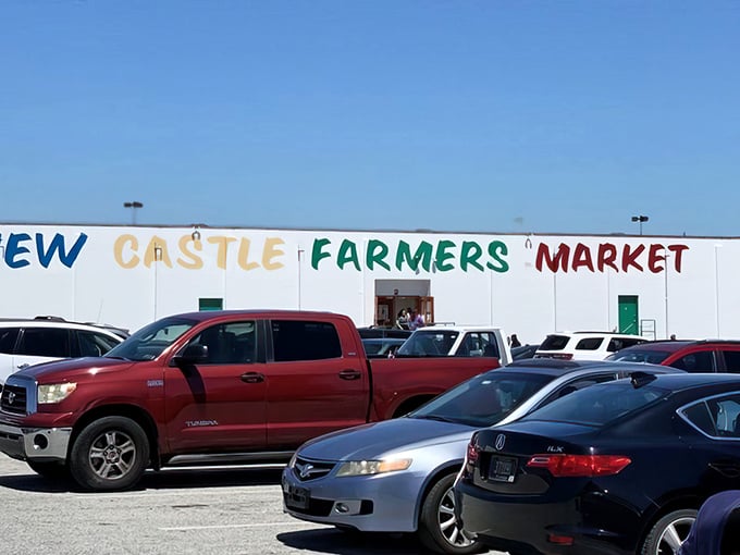 The unassuming white exterior of New Castle Farmers Market stands like a culinary speakeasy – nothing fancy outside, pure magic inside. Friday through Sunday only, folks!