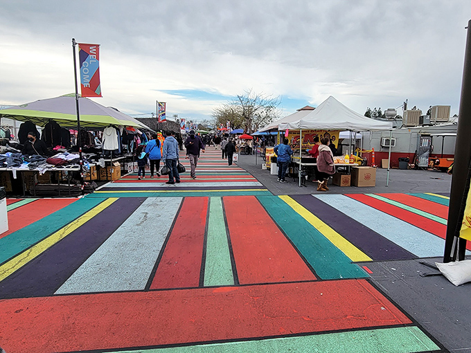 Treasure hunters navigate the bustling aisles of San Fernando Swap Meet, where colorful toys and clothing create a retail wonderland that makes mall shopping seem downright boring.