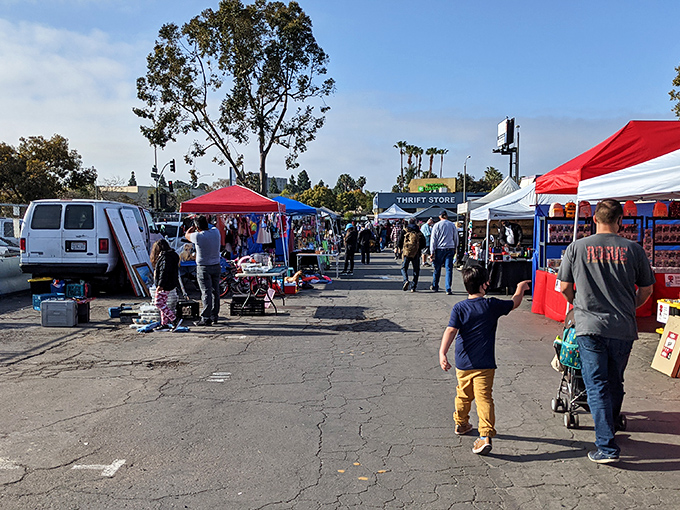 The iconic San Diego Sports Arena provides a dramatic backdrop for treasure hunters navigating the colorful maze of vendor stalls at Kobey's Swap Meet.