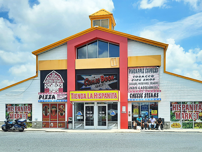 The rainbow-colored exterior of Laurel Junction beckons like a carnival barker promising treasures inside. Bold primary colors and straightforward signage set expectations: adventure awaits.