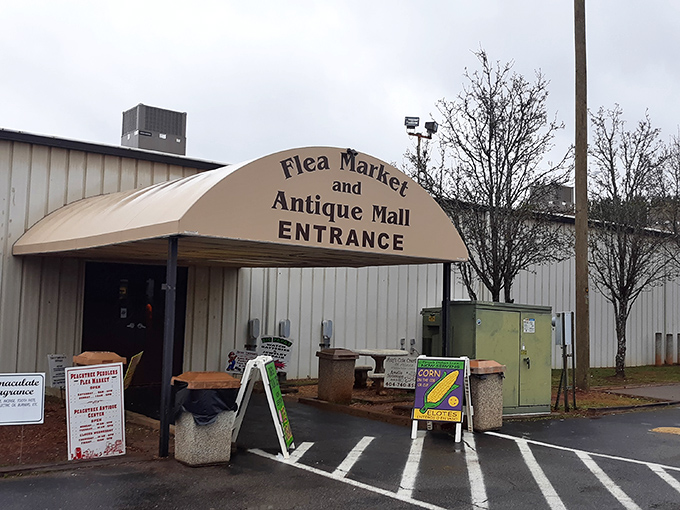 The unassuming entrance to Peachtree Peddler's &ndash; where treasure hunting begins beneath a simple awning that hides a world of wonders inside.