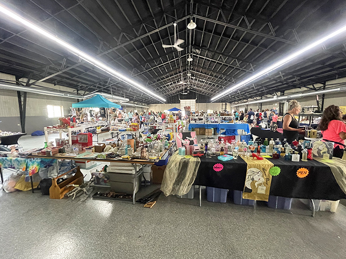 A treasure hunter's paradise stretches before you – tables laden with potential discoveries under the vast ceiling of possibility. Every aisle promises its own adventure.