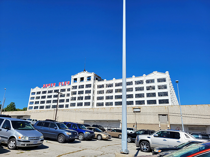 The iconic Super Flea entrance beckons bargain hunters with its no-frills charm and cartoon mascot—like a siren call for treasure seekers everywhere.