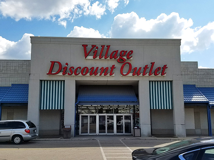 The iconic red signage of Village Discount Outlet beckons like a lighthouse for bargain hunters navigating the sea of retail options in Dayton.