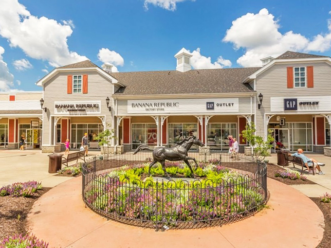 The architectural charm of Tanger Outlets Pittsburgh creates a village-like shopping experience, complete with iconic horse sculptures that serve as both art and meeting point.
