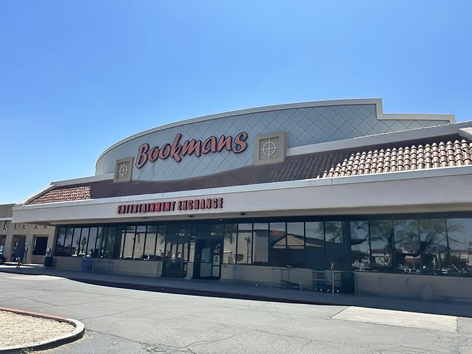 The iconic Bookmans storefront glows like a beacon for treasure hunters, promising adventures that Amazon's "add to cart" button could never deliver.