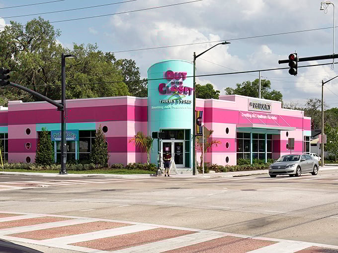 The unmistakable pink and turquoise facade of Out of the Closet stands out like a flamingo in a penguin convention, beckoning bargain hunters with its vibrant charm.