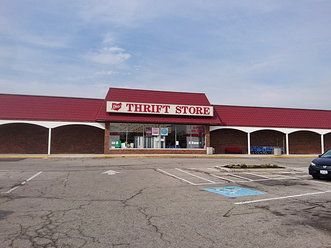 The iconic red-roofed Ohio Thrift Store stands like a treasure chest waiting to be opened, promising adventures in bargain hunting behind its modest facade.