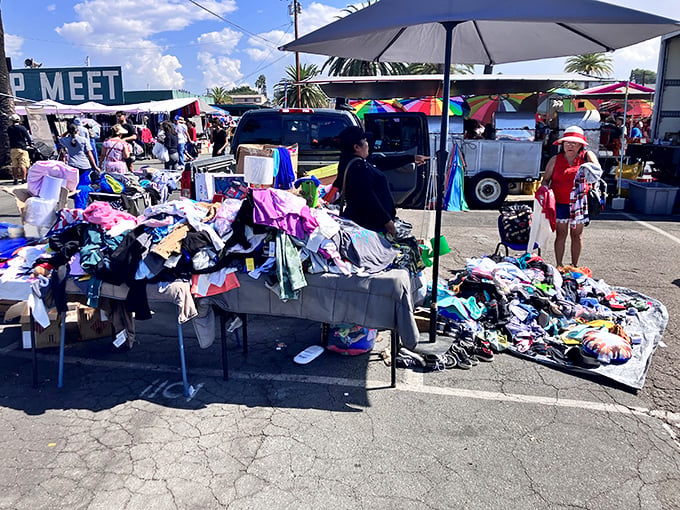 A treasure hunter's paradise under the California sun, where mountains of colorful clothing await their next adventure. Bargain nirvana!