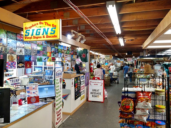 Wooden beams frame treasure hunters as they navigate aisles of history. The market's rustic architecture creates the perfect backdrop for discovery.