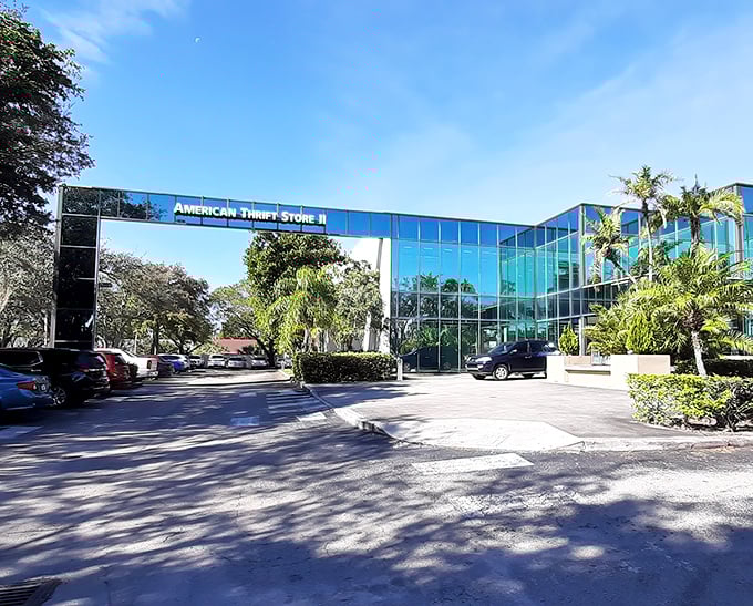 The sleek, modern exterior of American Thrift Store belies the treasure trove within. Palm trees stand guard like sentinels of savings.