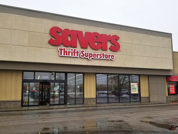 The bold red Savers sign beckons like a lighthouse for bargain hunters navigating the sea of retail sameness.