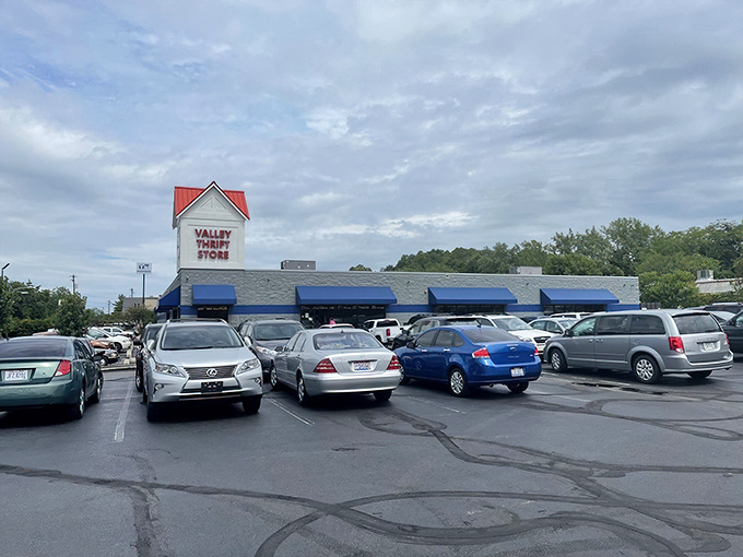 The blue-trimmed exterior of Valley Thrift Store stands like a beacon for bargain hunters, promising treasures within its unassuming walls.