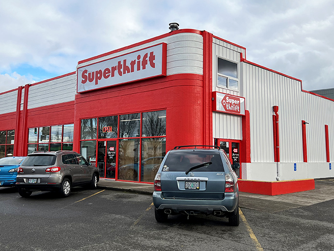 The bright red exterior of SuperThrift beckons like a siren call to bargain hunters, promising treasures within those unassuming walls.