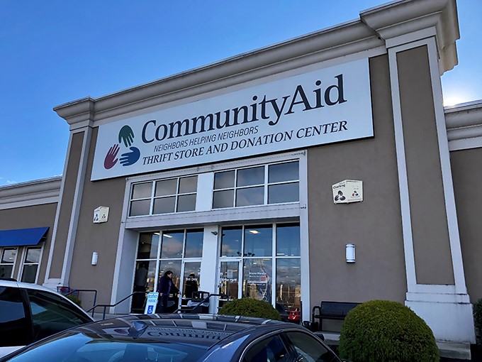 The welcoming storefront of CommunityAid stands ready for treasure hunters, where retail therapy meets community impact under the bright Pennsylvania sky.
