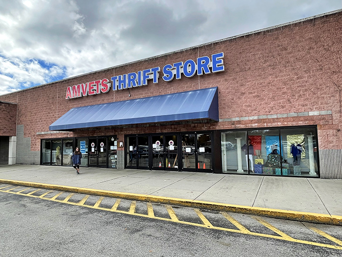 The brick facade and bold blue awning hide a universe of possibilities within. Like a portal to another dimension where treasures await the patient explorer.