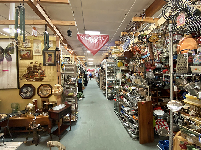 Nebraska Avenue stretches into infinity, flanked by treasures from every era. One wrong turn and you might emerge decades later with armfuls of newfound obsessions.