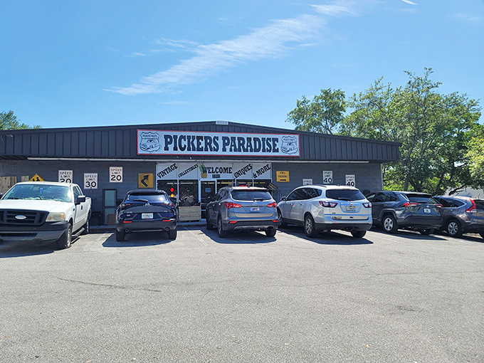 The unassuming exterior of Pickers Paradise belies the wonderland within. Vintage road signs hint at the time-traveling adventure awaiting treasure hunters inside.