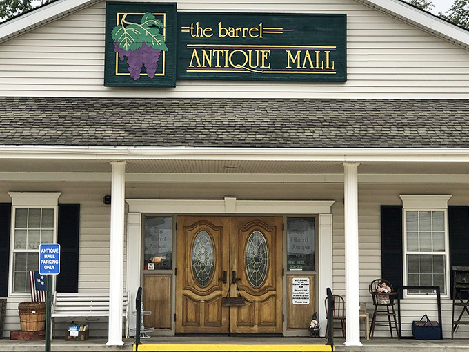 The welcoming facade of The Barrel Antique Mall beckons with its charming porch and elegant wooden doors&mdash;a modest exterior that belies the wonderland within.