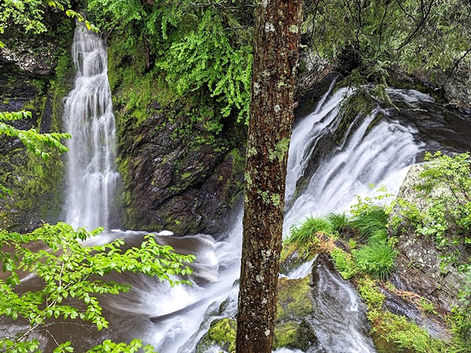 Nature's three-tiered masterpiece puts on a spectacular show, with rushing water carving through ancient rock formations in Pennsylvania's hidden gem.