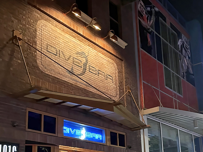 The brick facade of Dive Bar beckons with its illuminated mermaid logo &ndash; Sacramento's answer to "what if Ariel opened a cocktail lounge?"