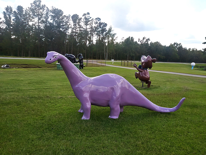 A blue ram with golden horns holds court over a gathering of Smurfs. Childhood nostalgia meets roadside whimsy in this delightfully odd tableau.