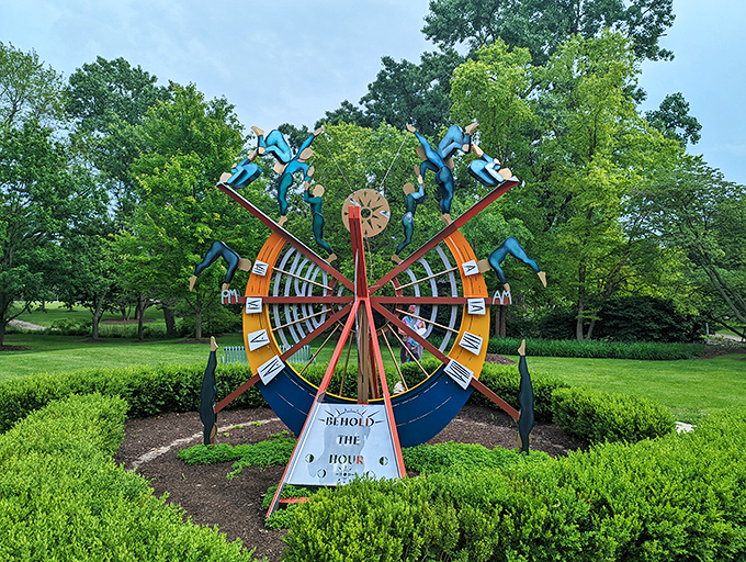 Time takes a colorful spin at this whimsical clock sculpture, where art meets function in a burst of blue figures dancing around the hours.