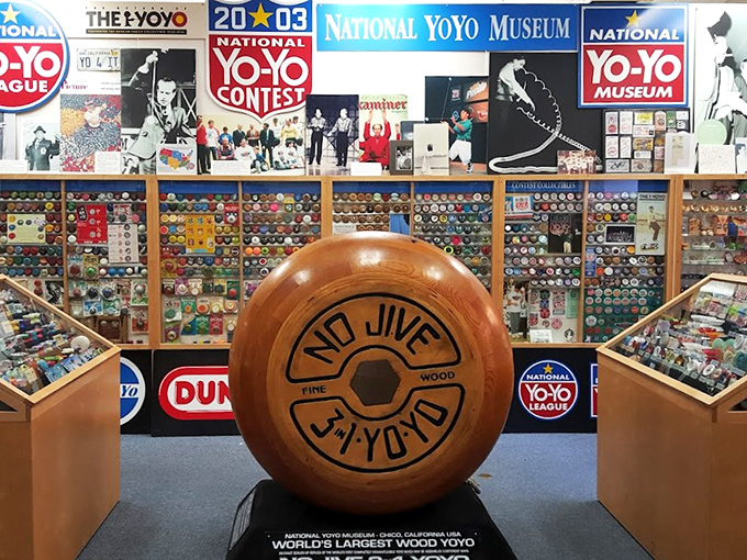 Big Yo stands proudly at center stage, a wooden giant among its tiny relatives. The world's largest wooden yo-yo commands attention like a celebrity at its own premiere.