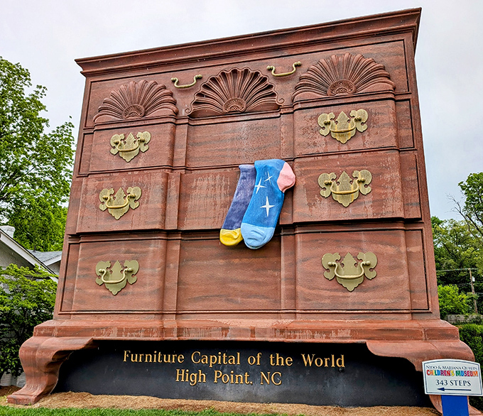 The World's Largest Chest of Drawers stands proudly in High Point, complete with gigantic blue socks that look ready for a cosmic slumber party.